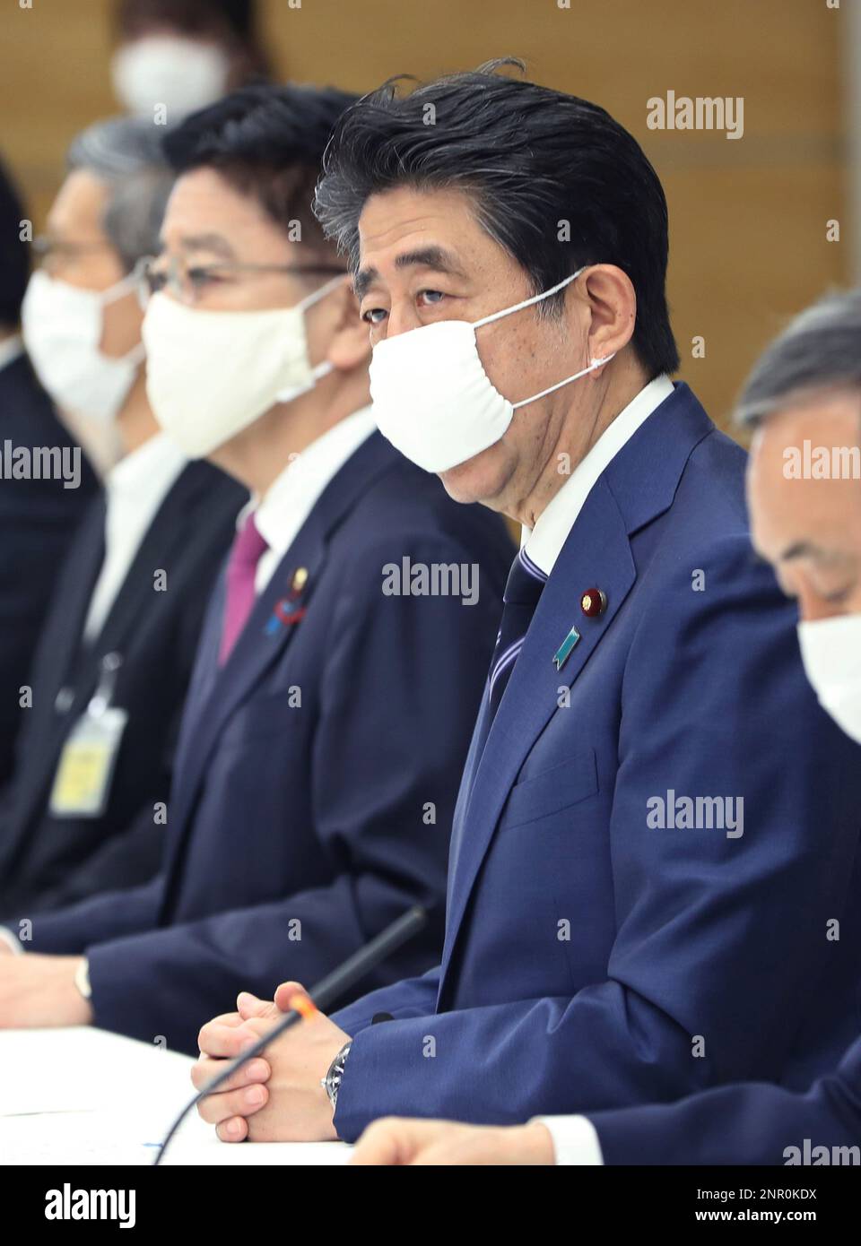 Japan's Prime Minister Shinzo Abe wearing face mask (abenomask) attends ...