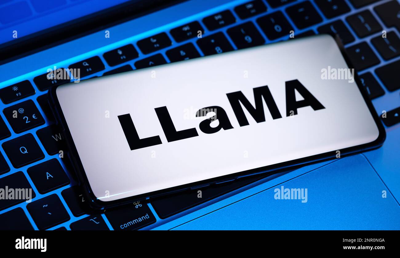 LLaMA letters seen on smartphone and blurred Meta company logo on ...