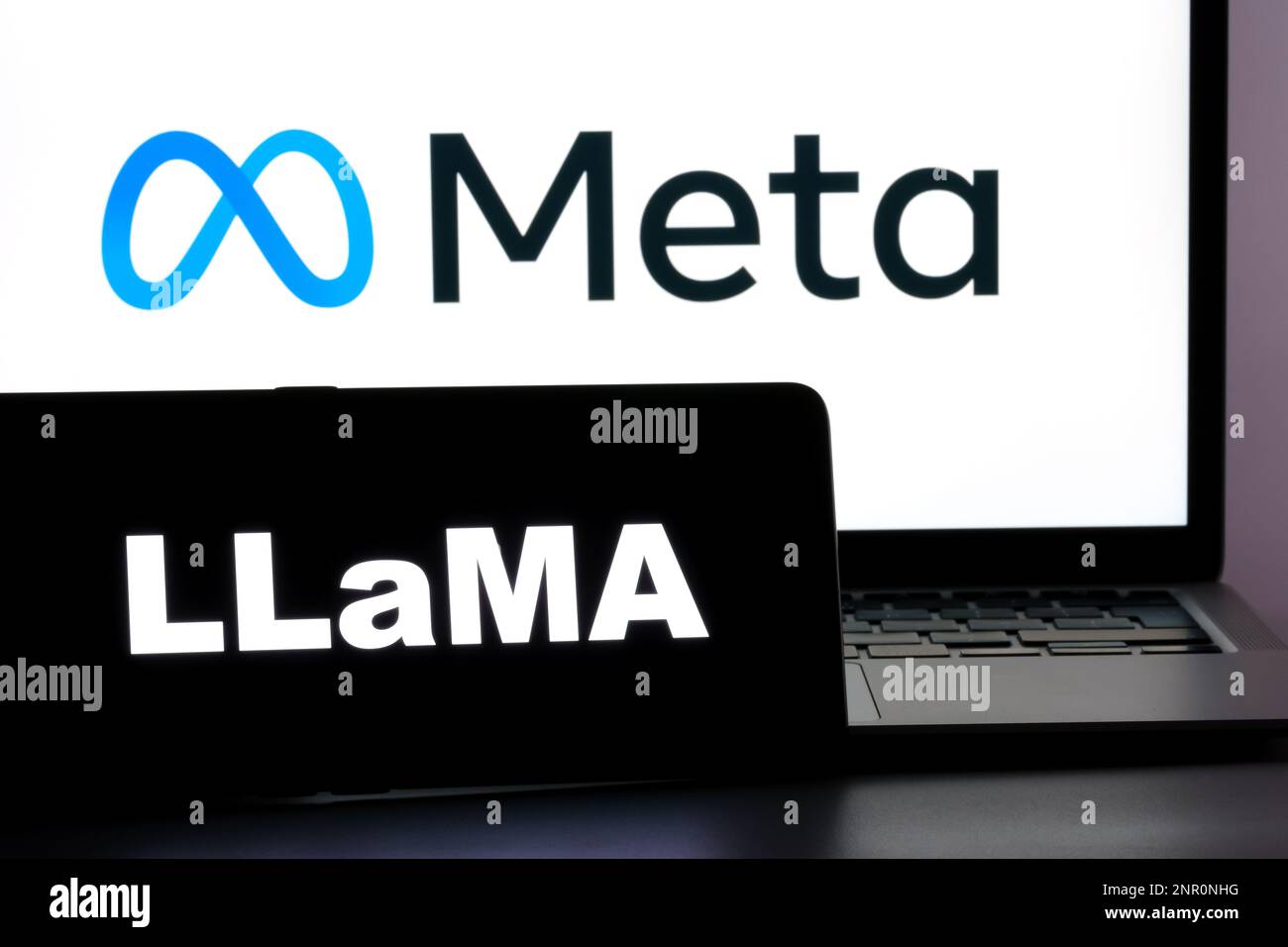 LLaMA letters seen on smartphone and blurred Meta company logo on ... LLaMA letters seen on smartphone and blurred Meta company logo on ...