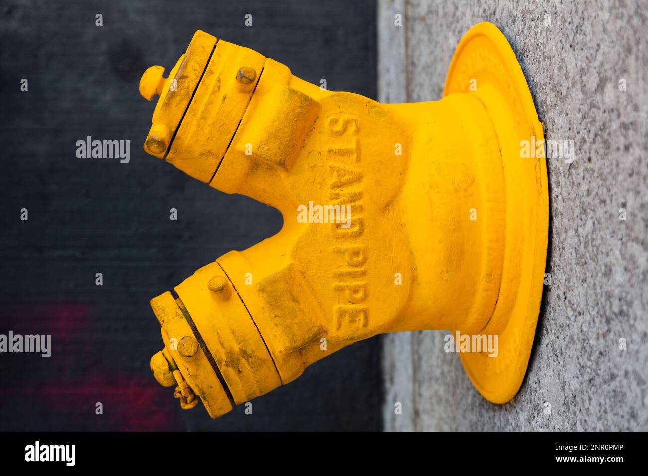 picture of an old yellow standpipe at a building in New York City, USA ...