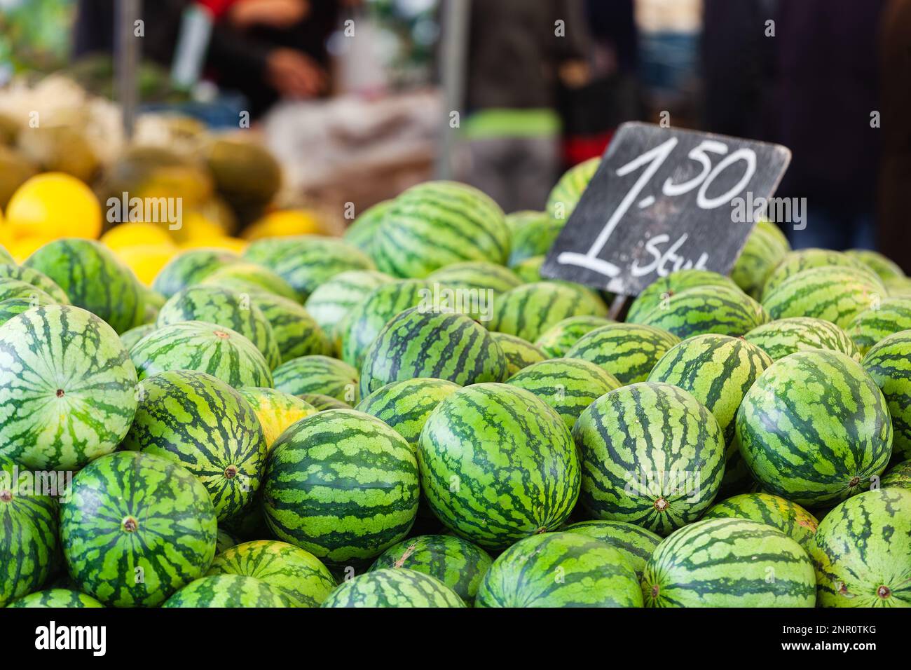 picture of a stack of melons on a stall at a street market Stock Photo ...