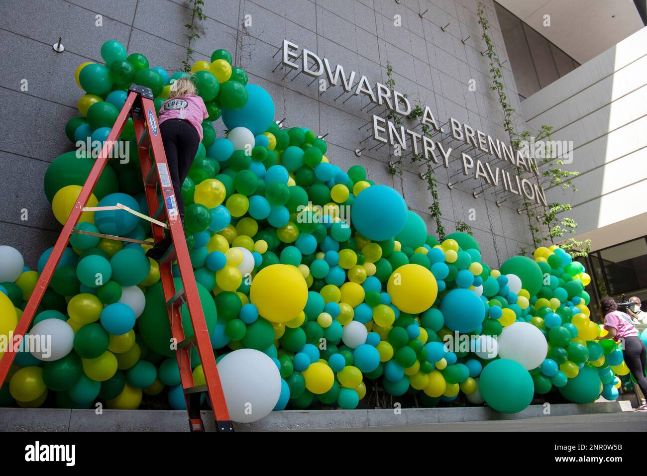Elaine Frei, left, and Caroline Dodd with Luft Balloon install a ...