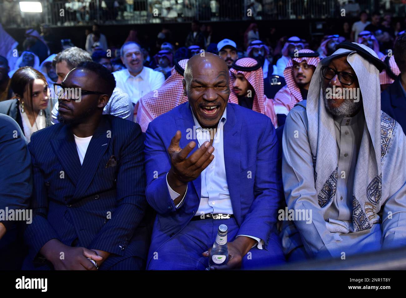 Mike Tyson, center, attends the boxing match between Jake Paul and ...