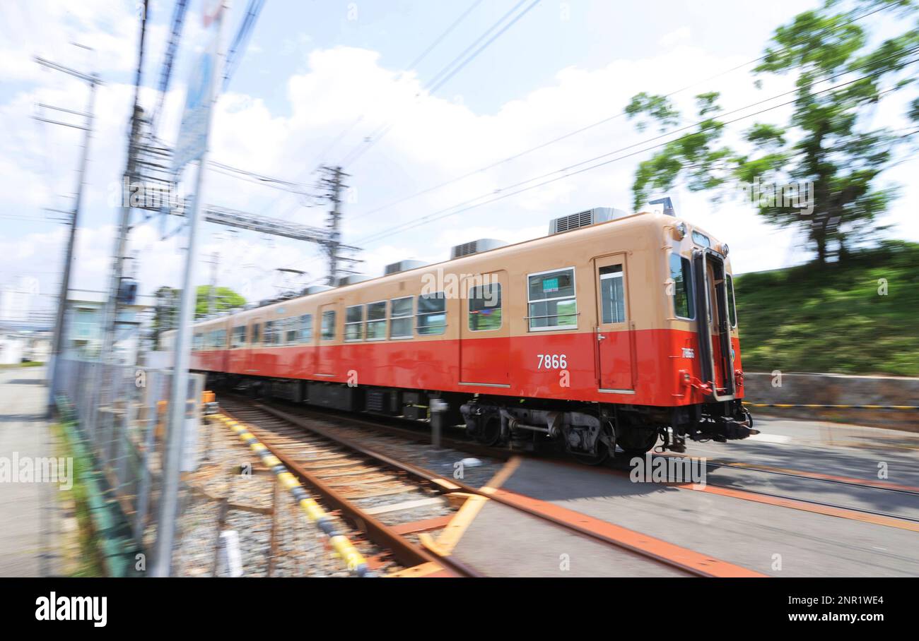 A picture shows so-called Akado-sha, red body train, near Higashinaruo ...
