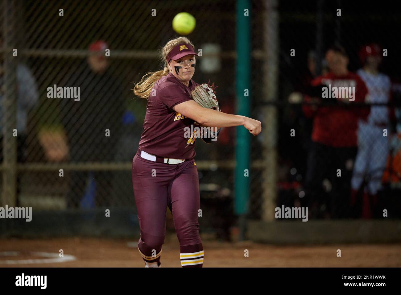 Minnesota Golden Gophers third baseman Katelyn Kemmetmueller throws to ...