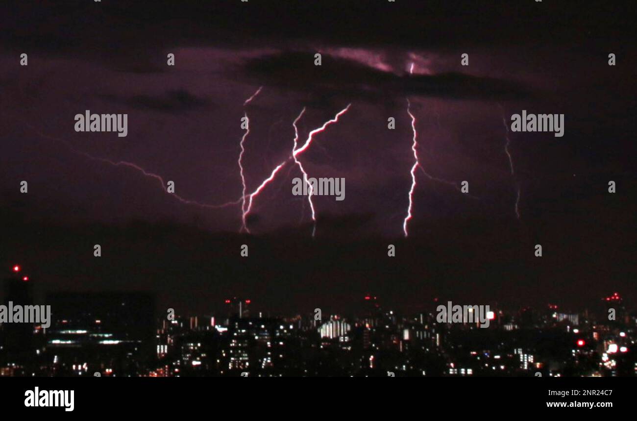 A bolt of lightning strikes in the heart of the city in Tokyo on May 6 ...