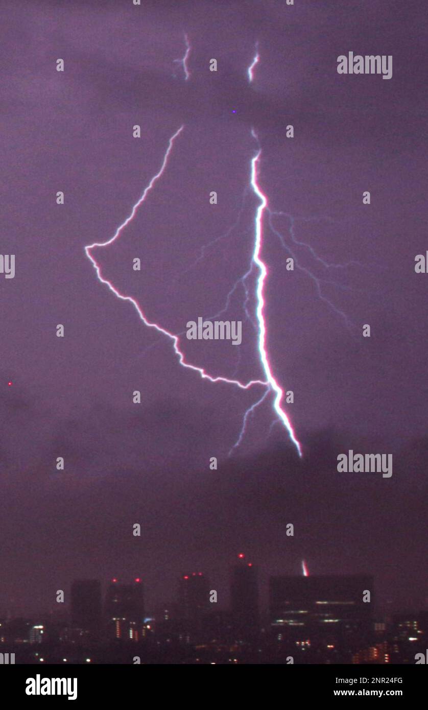 A bolt of lightning strikes in the heart of the city in Tokyo on May 6 ...