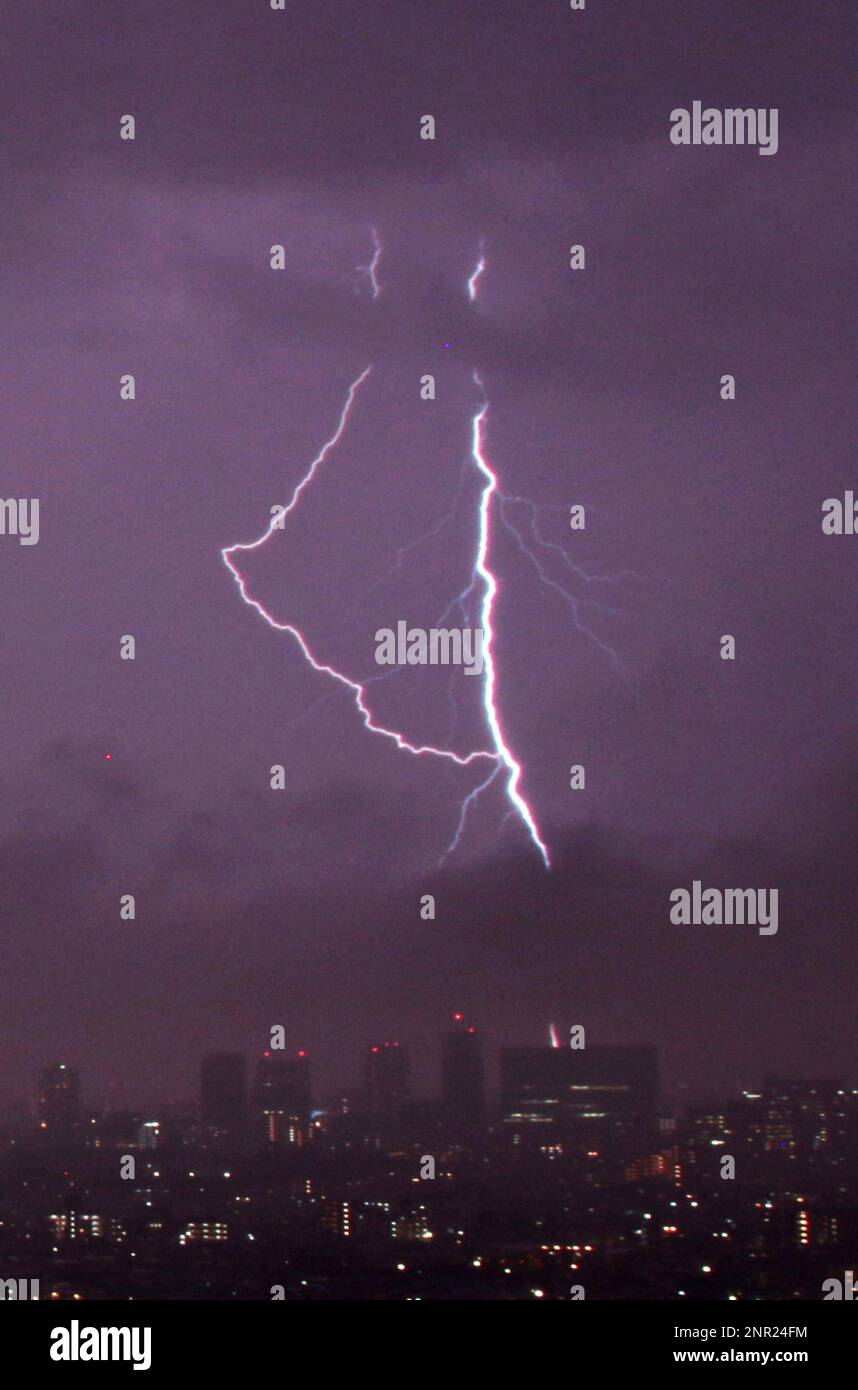 A bolt of lightning strikes in the heart of the city in Tokyo on May 6 ...