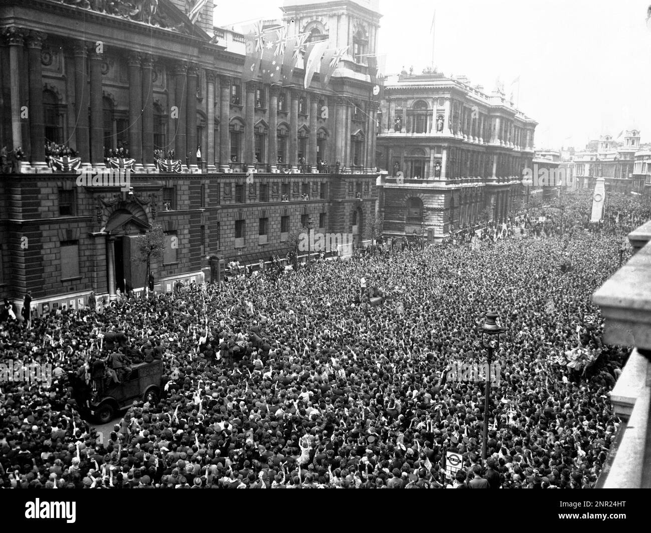 FILE - In this May 8, 1945 file photo crowds of civilians, British and ...