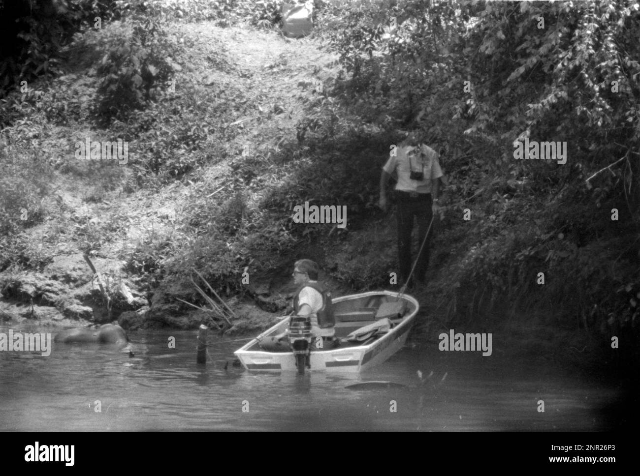 Investigators pull the body of missing person and victim Nathaniel ...