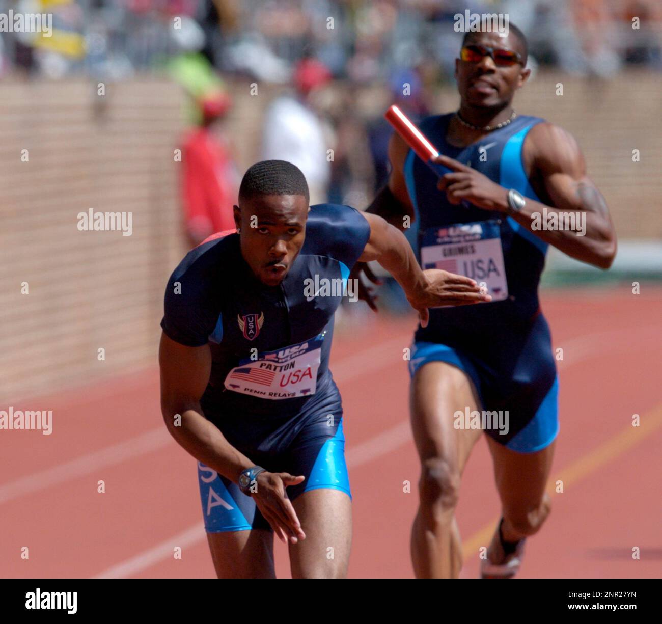 Mickey Grimes hands off to Darvis Patton on the third leg of the USA ...
