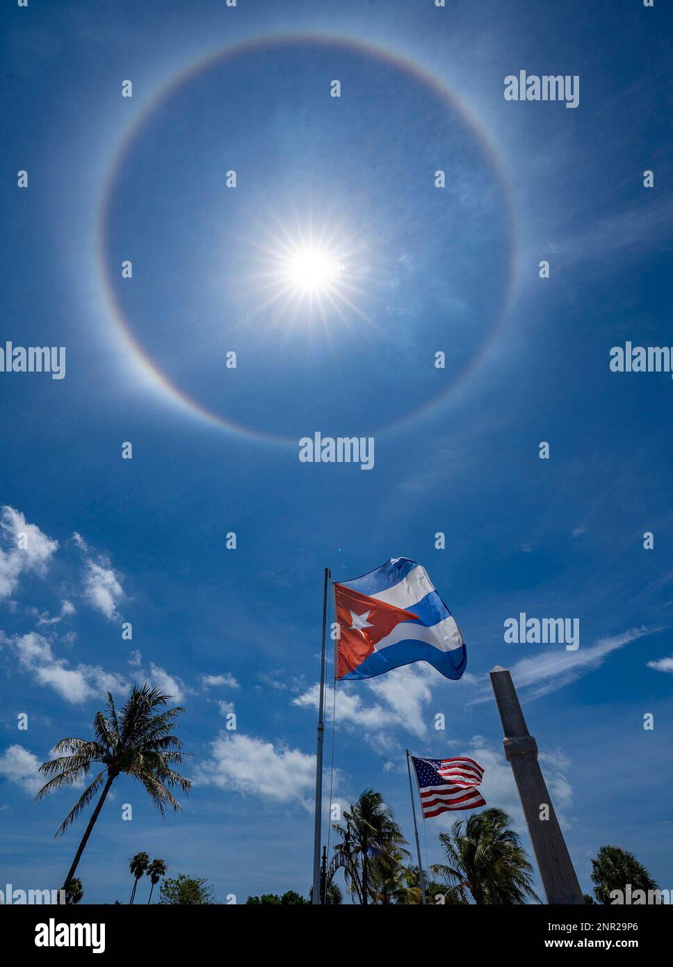 A solar halo, also known as a 22 degree halo, appears over a Cuban ...