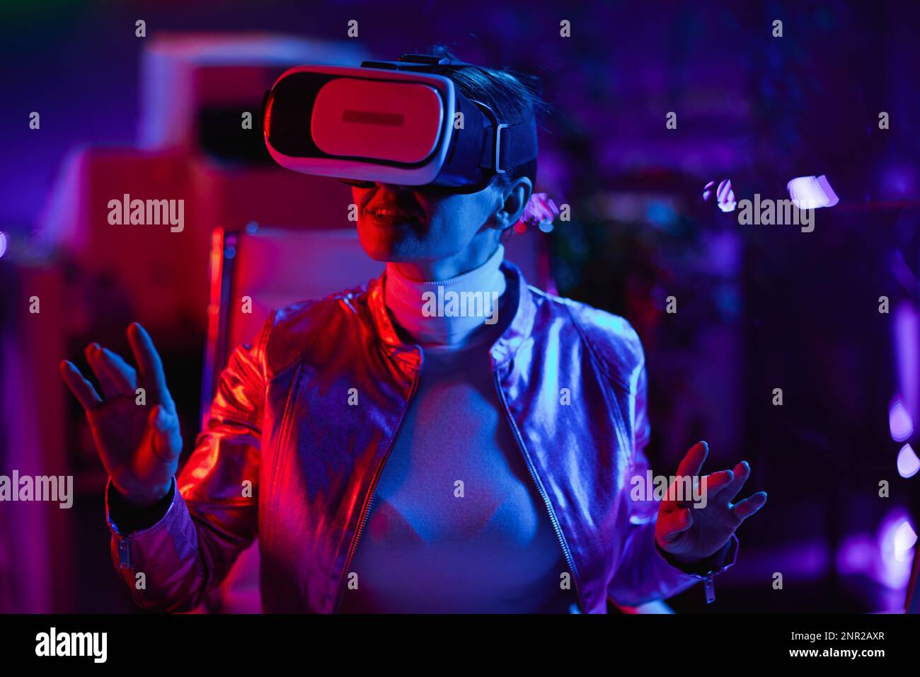 Neon metaverse futuristic concept. happy trendy 40 years old woman in ...