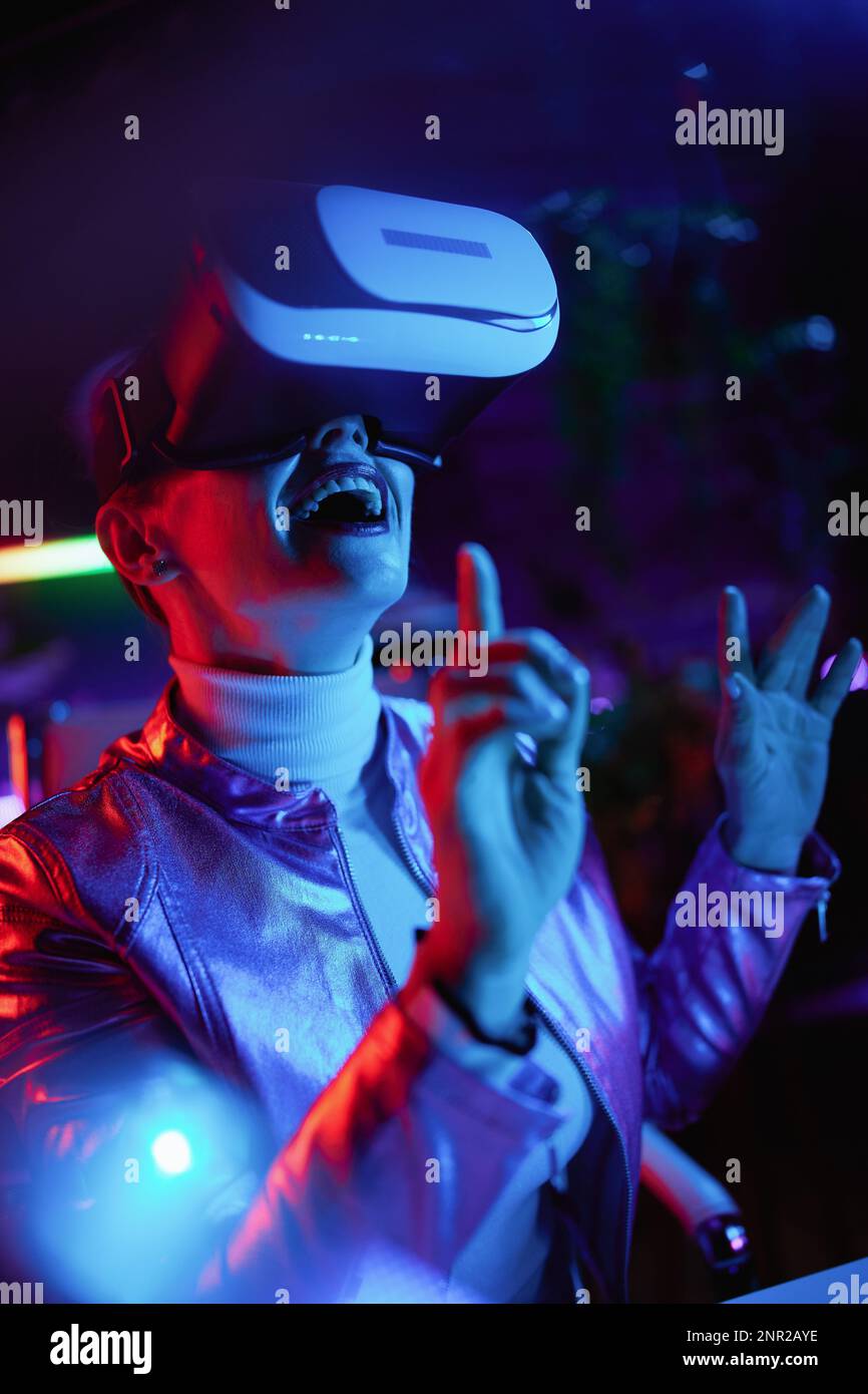 Neon metaverse futuristic concept. smiling elegant 40 years old woman ...