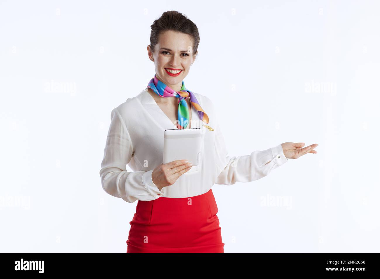 smiling stylish flight attendant woman against white background in ...