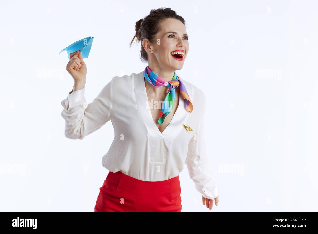 smiling elegant flight attendant woman against white background in ...