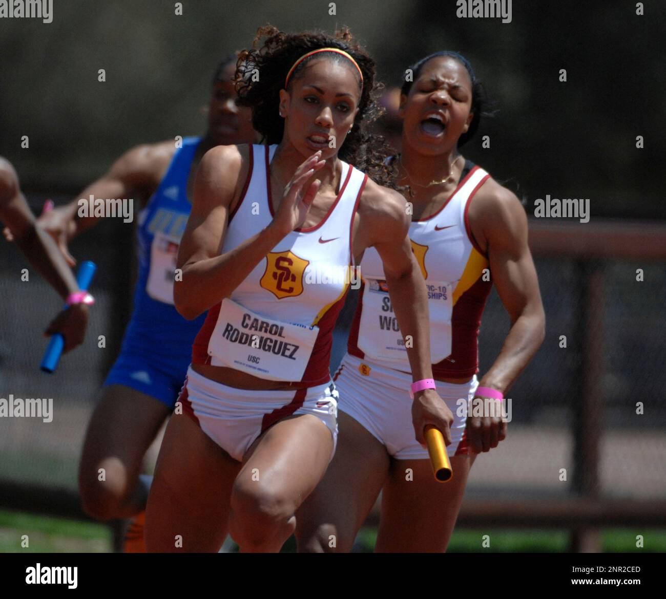 Carol Rodriguez of USC takes handoff from Shana Woods on the anchor of ...
