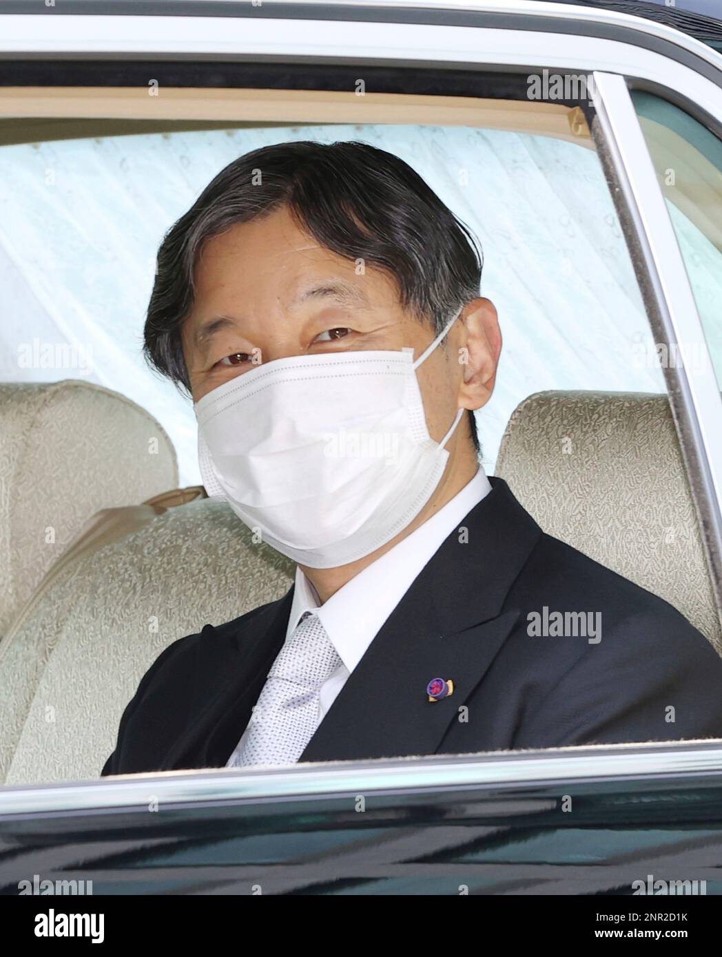 Japan's Emperor Naruhito wearing a mask arrives at Imperial Palace in ...