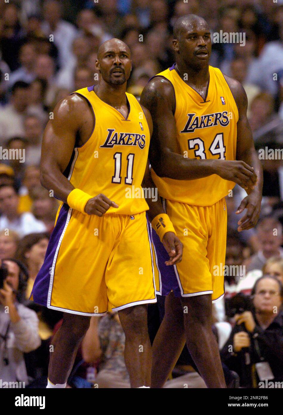 Karl Malone (11) and Shaquille O'Neal (34) of the Los Angeles Lakers ...