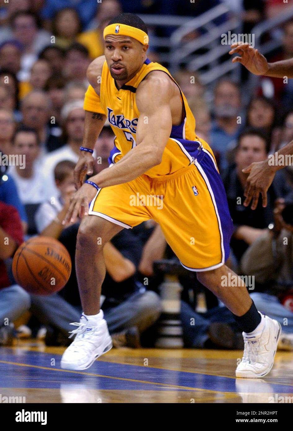 Derek Fisher of the Los Angeles Lakers dribbles the ball against the ...