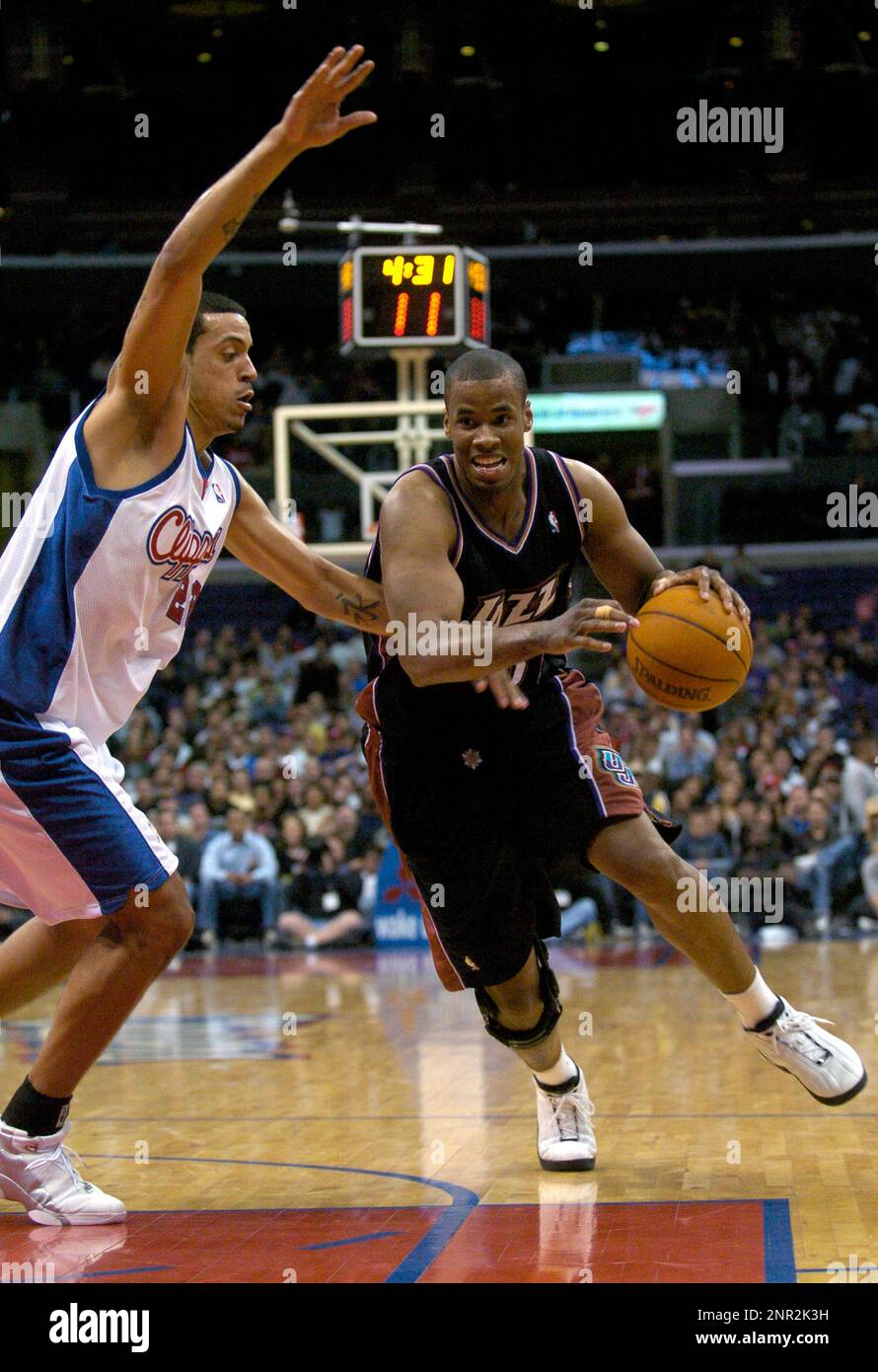 Jarron Collins of the Utah Jazz drives to basket against Eddie House of ...