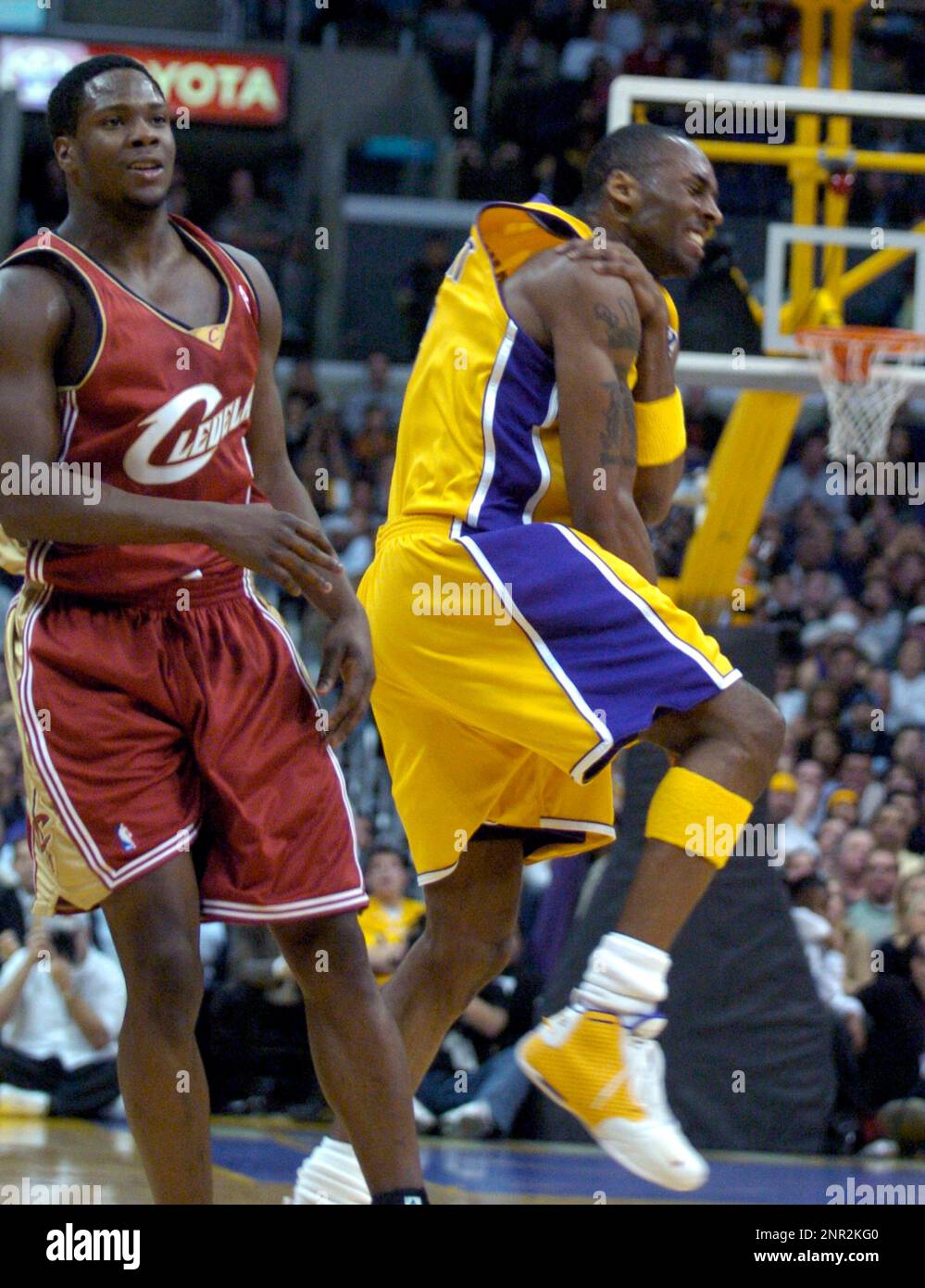 Kobe Bryant of the Los Angeles Lakers grimaces after suffering a ...