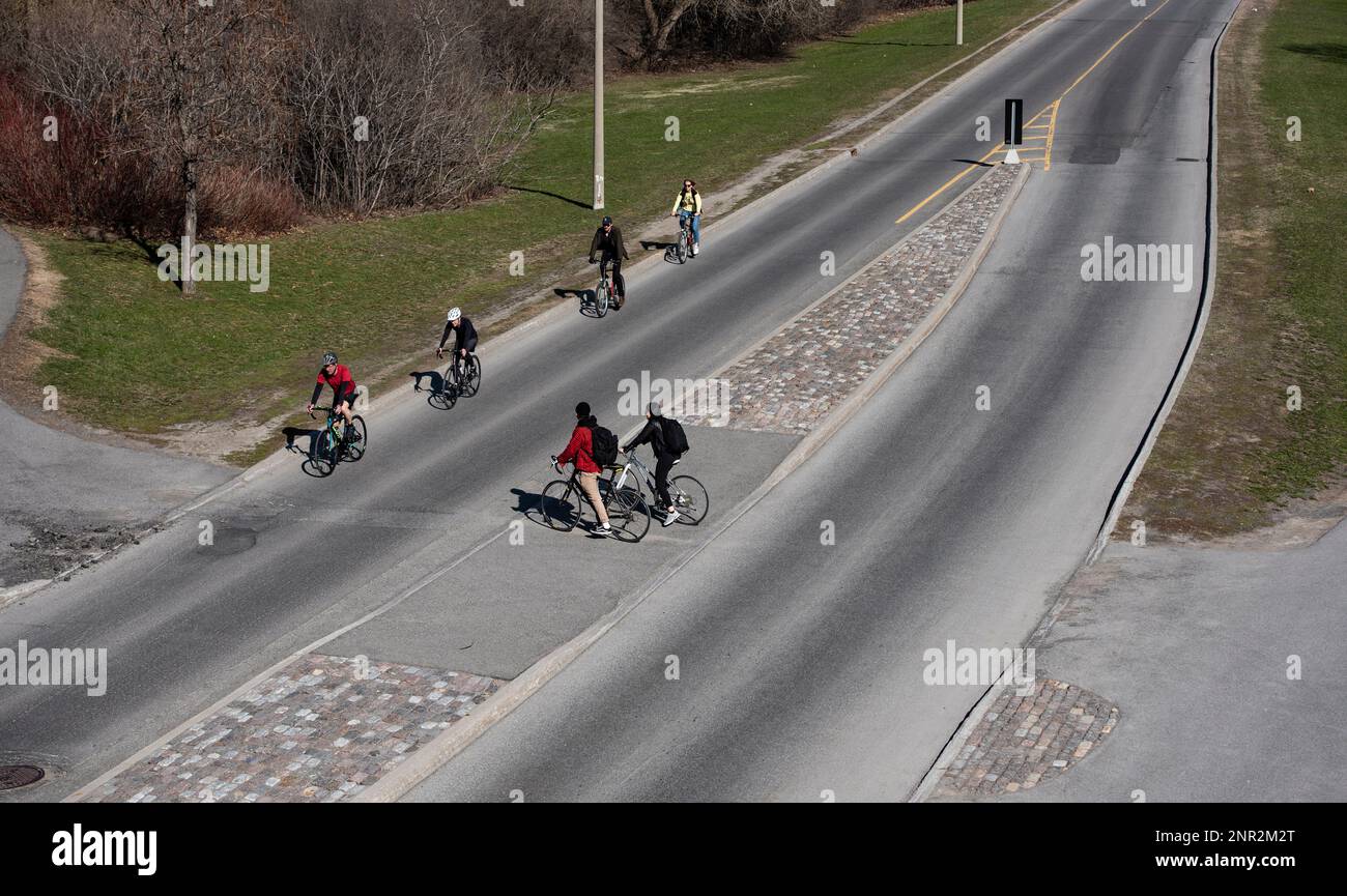 Cyclists make their way along Colonel By Drive in Ottawa, Ontario, as ...