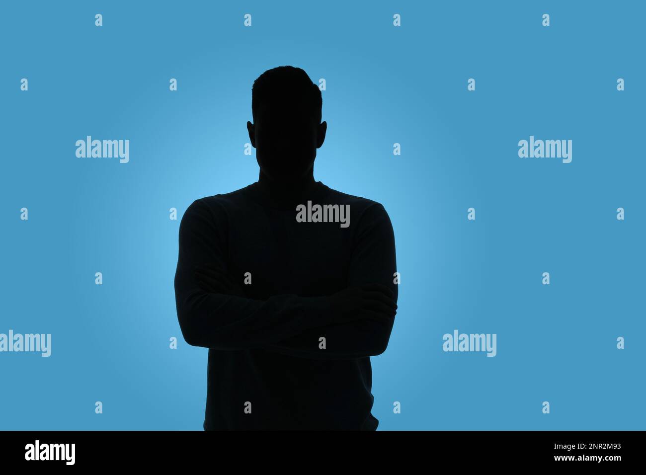 Silhouette of anonymous man on light blue background Stock Photo - Alamy