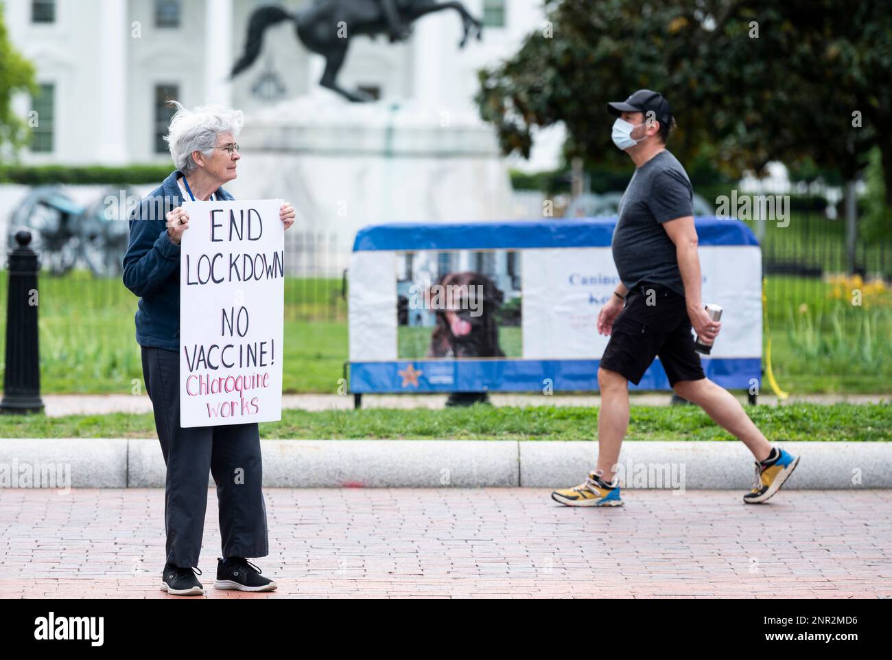UNITED STATES - APRIL 25: A lone protester holds a sign calling for an ...