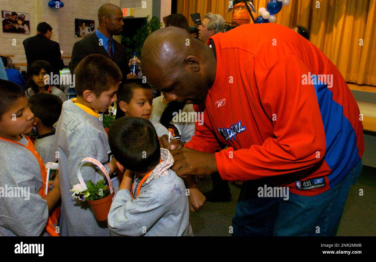 Josh Moore of the Los Angeles Clippers signs autographs at unveiling ...