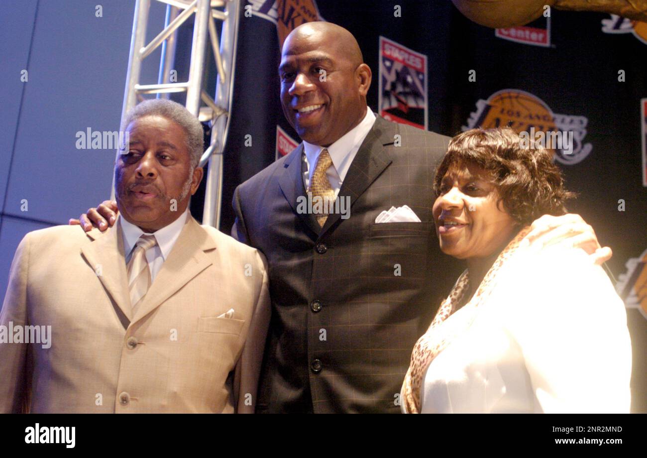 Magic Johnson poses with his mother Christine Johnson (left) and father ...