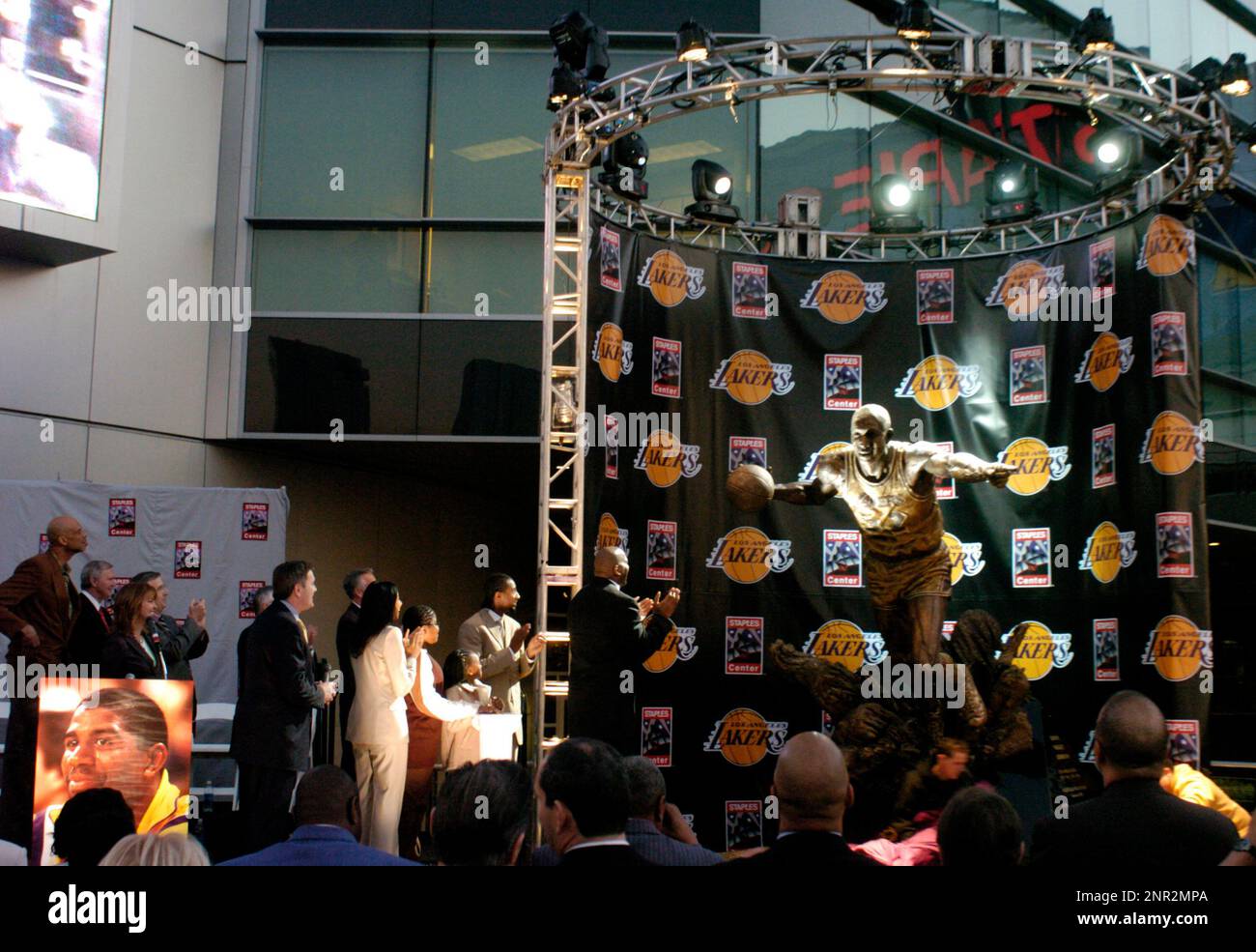 Magic Johnson and spectators watch during unveiling of 14-foot bronze ...