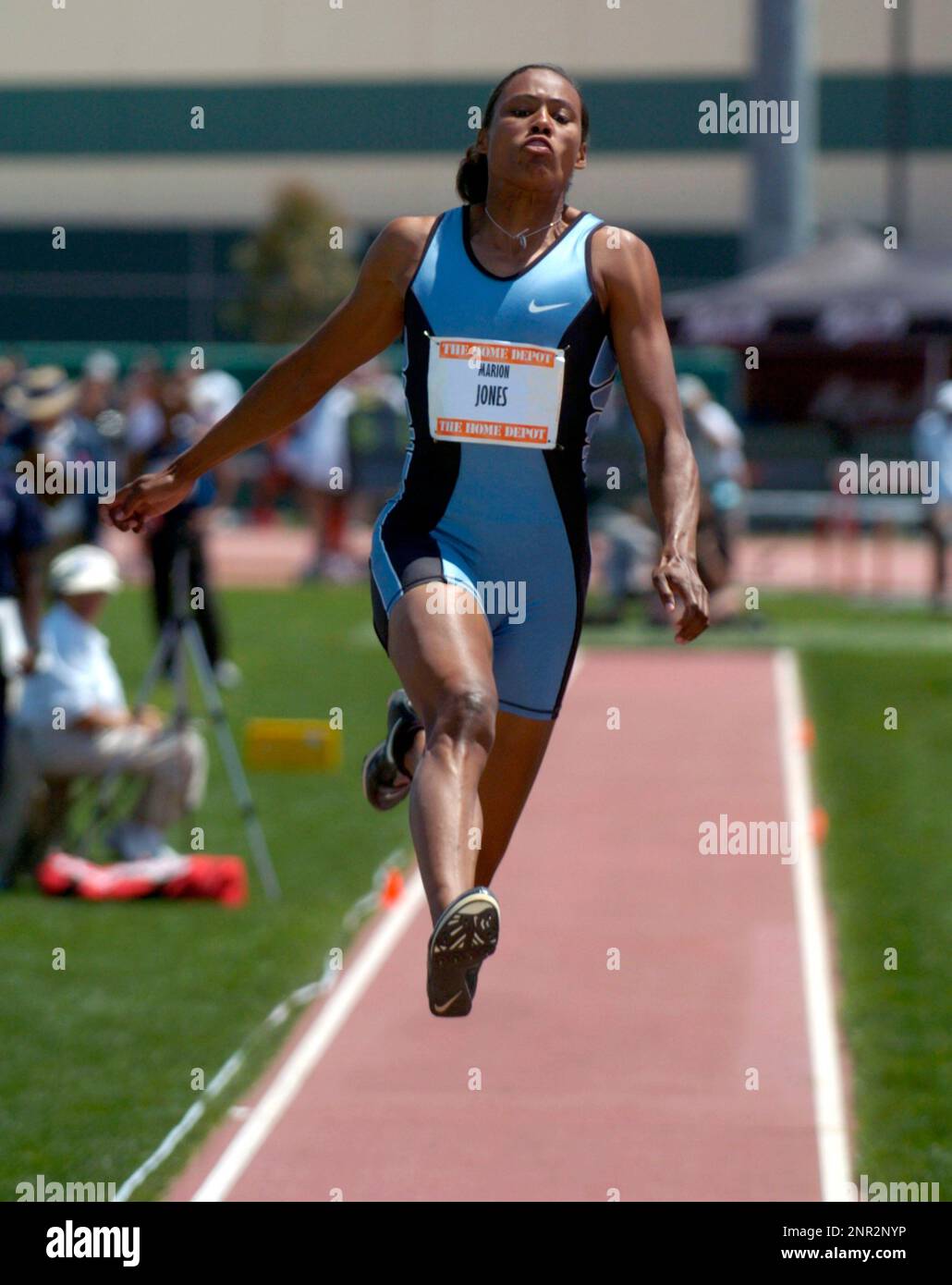 Marion Jones wins the women's long jump at a wind-aided 23 feet, 4 3/4 ...