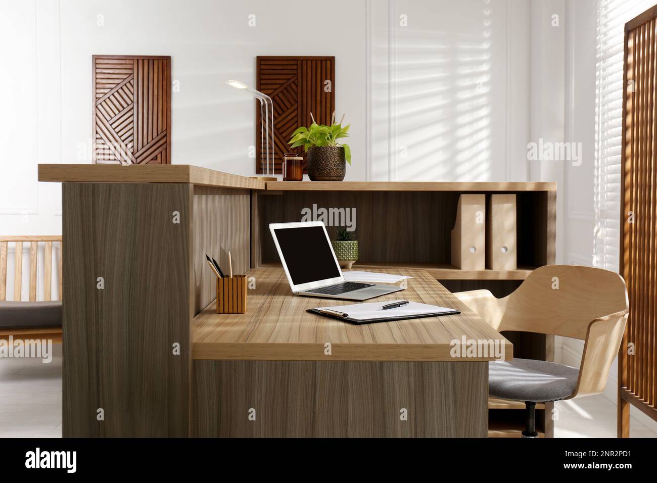 Receptionist's workplace with laptop in hotel. Interior design Stock ...