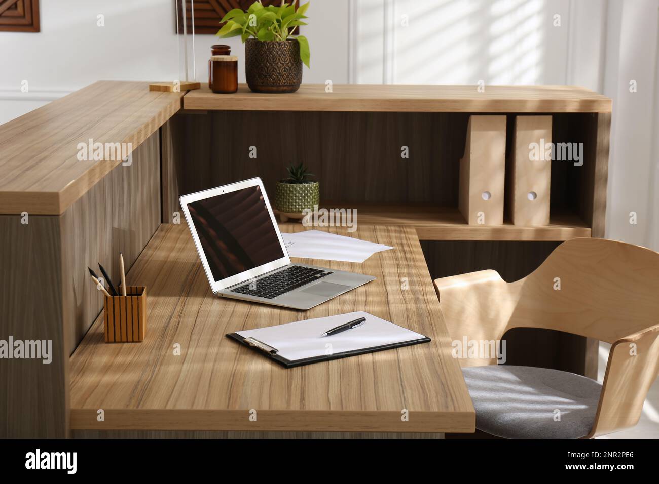 Receptionist's workplace with laptop in hotel. Interior design Stock ...