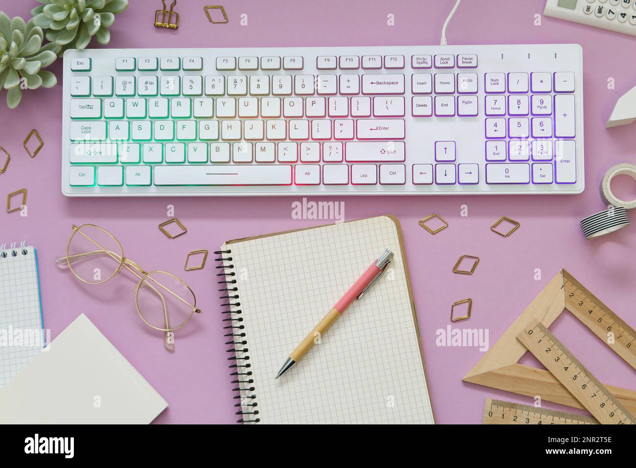 Flat lay composition with modern RGB keyboard on pink background Stock ...