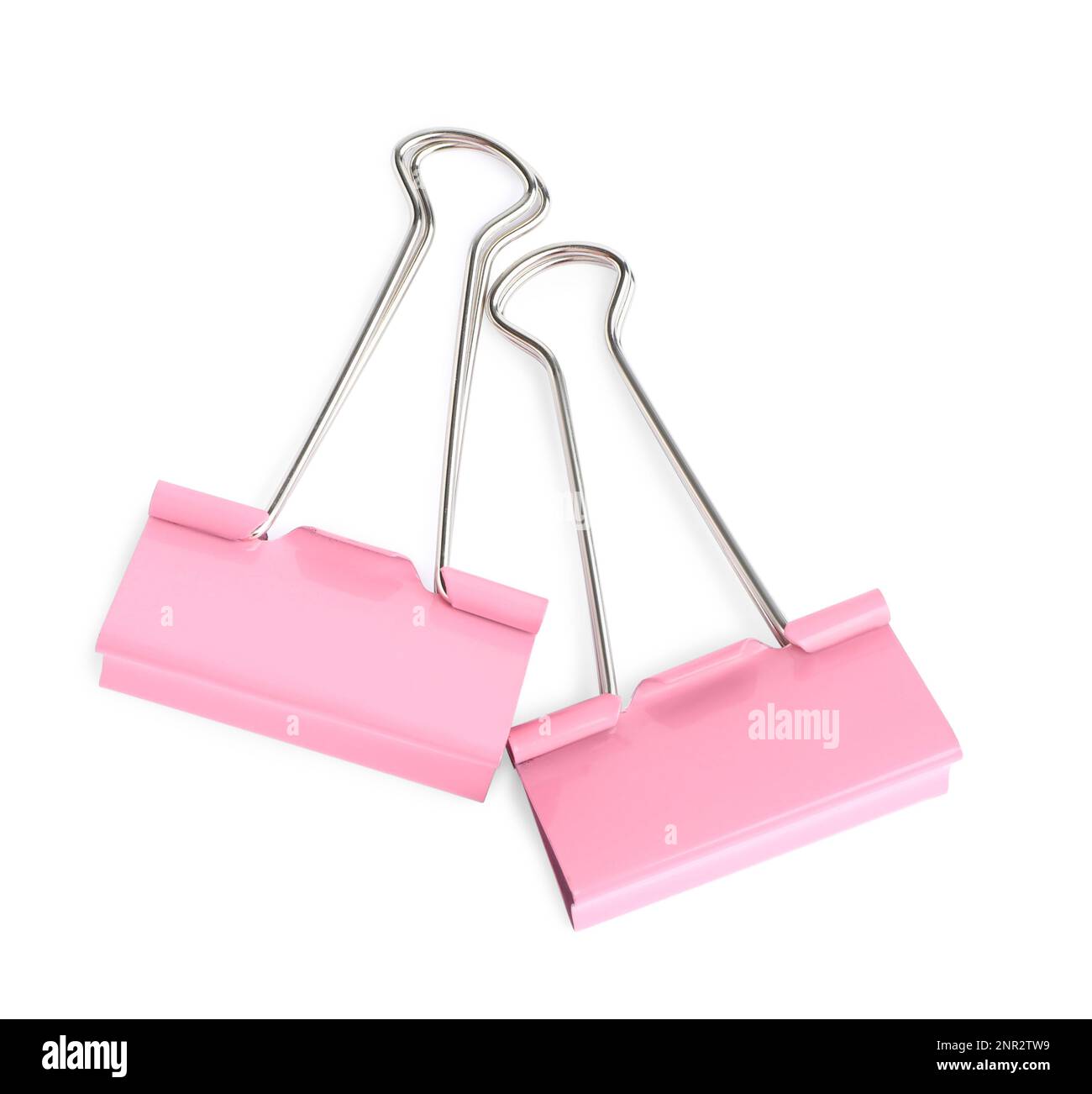 Pink binder clips on white background, above view. Stationery item ...