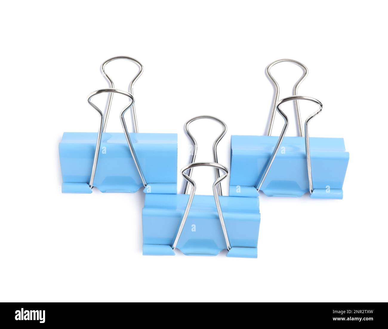 Blue binder clips on white background, top view. Stationery item Stock ...