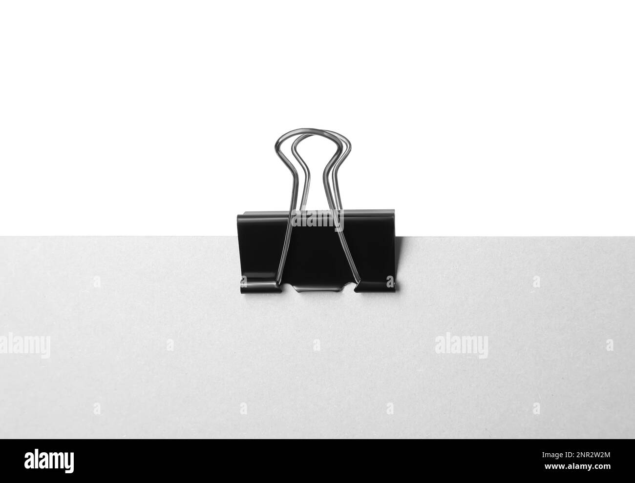 Paper with black binder clip isolated on white Stock Photo - Alamy