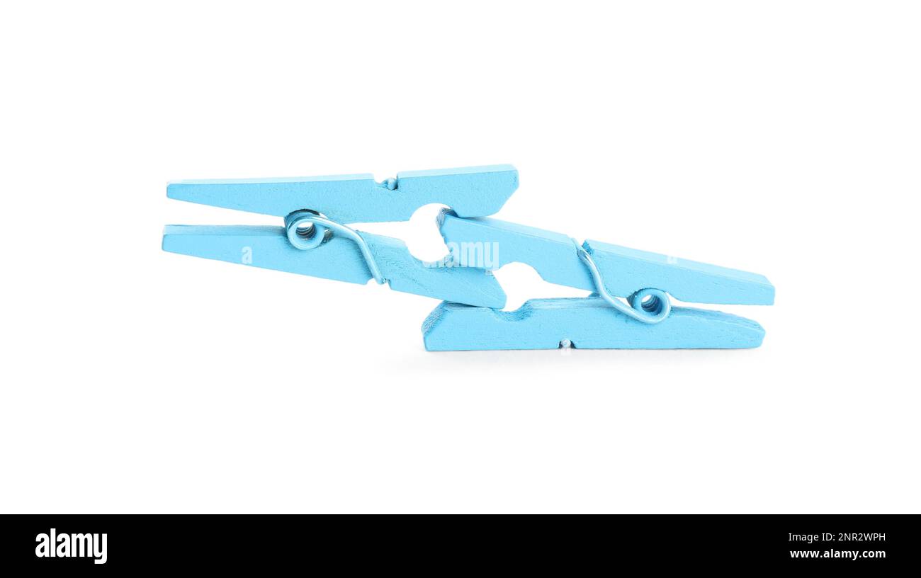 Two light blue wooden clothespins on white background Stock Photo - Alamy