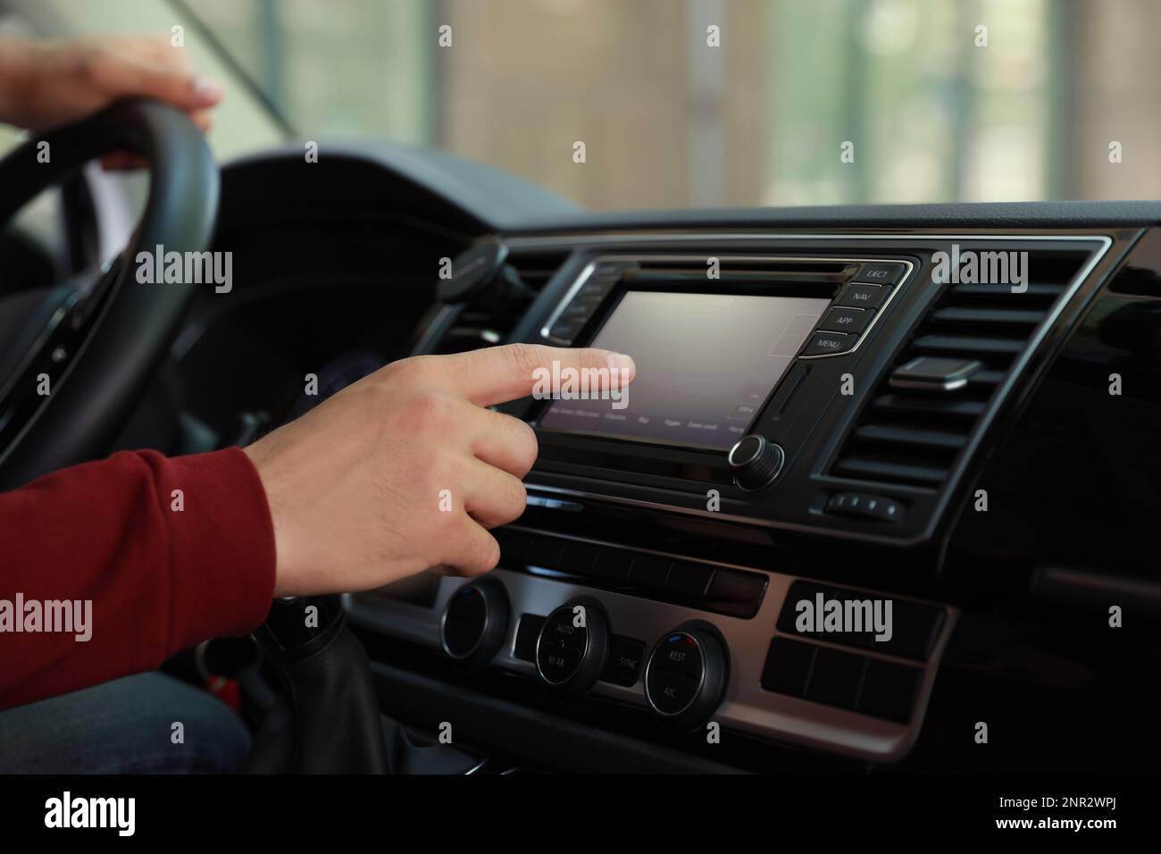 Man using navigation system while driving car, closeup Stock Photo - Alamy