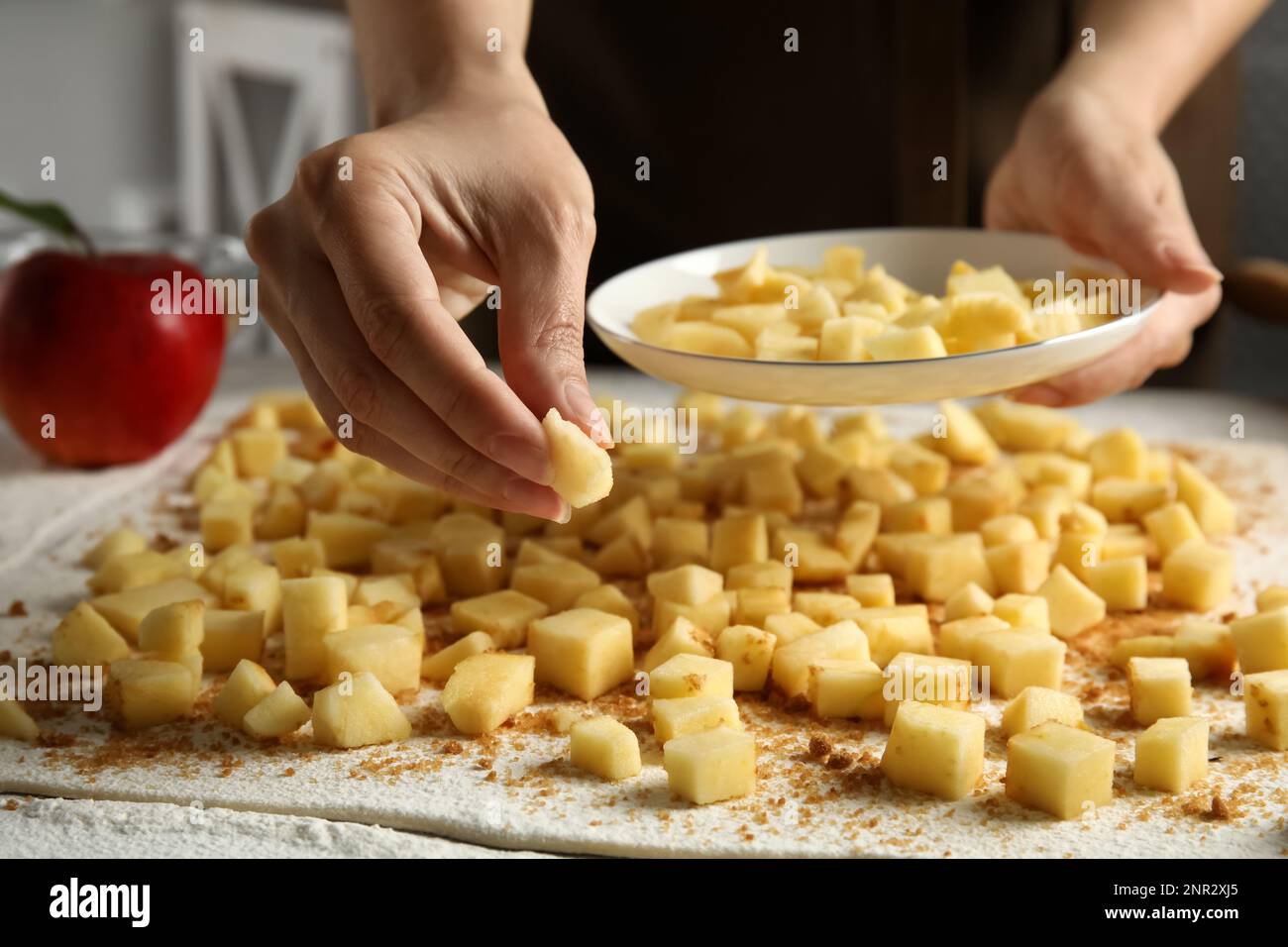 Woman making delicious apple strudel hi-res stock photography and ...