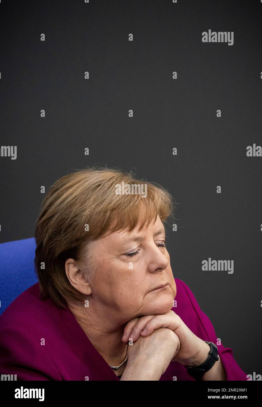 German Chancellor Angela Merkel closes her eyes as she attends a ...