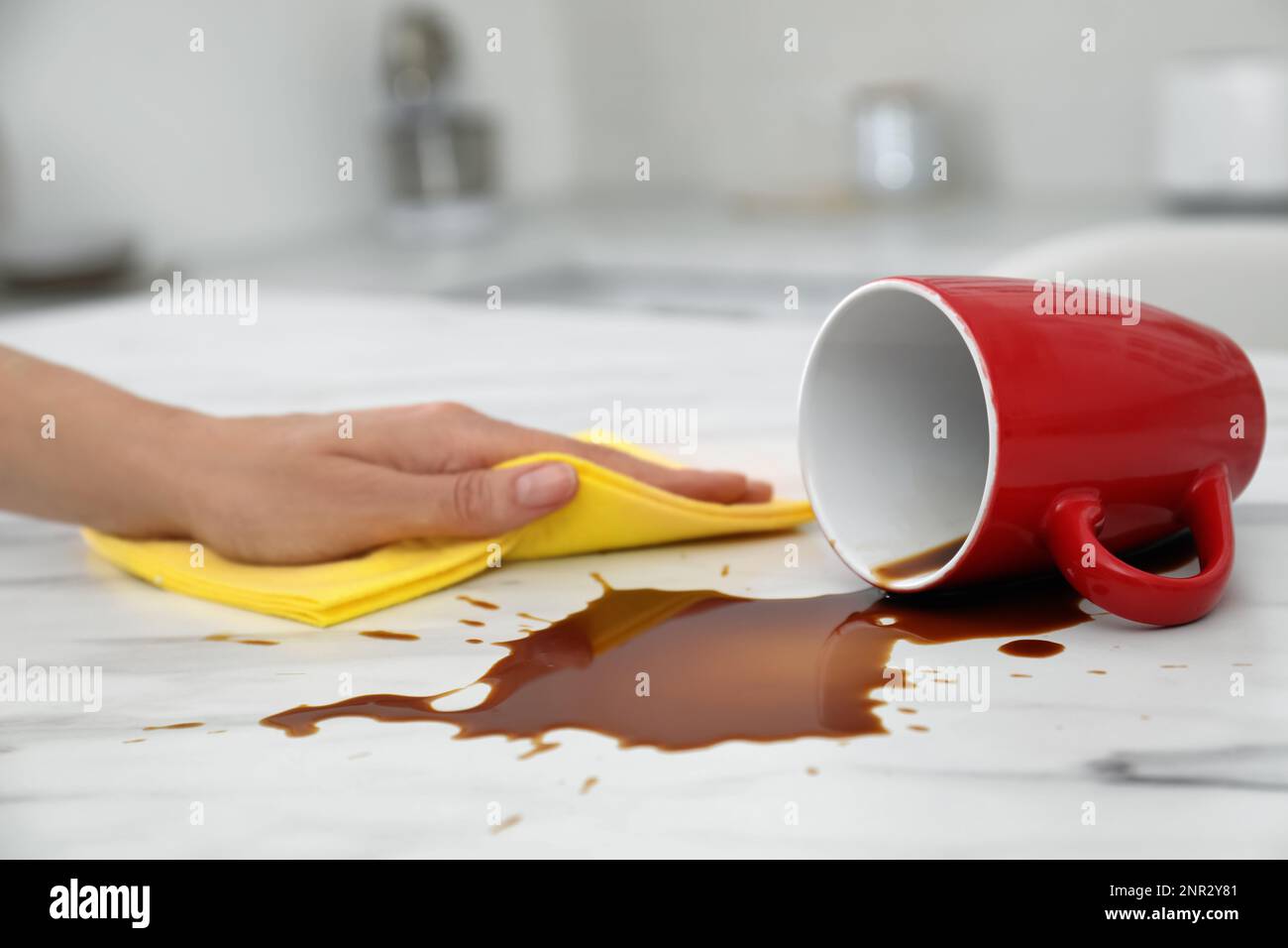 Hand wiping spilled coffee hi-res stock photography and images - Alamy