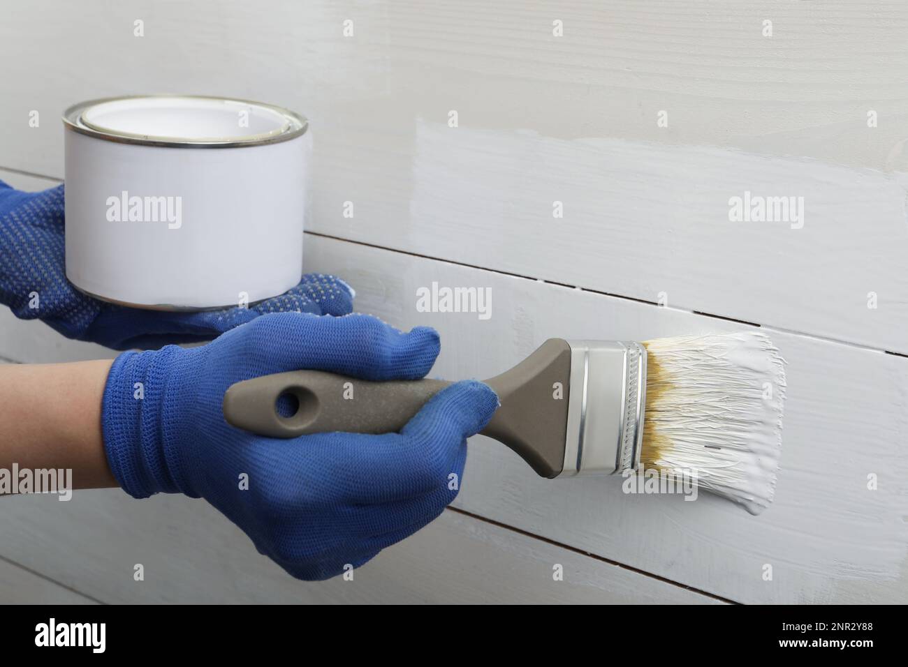 Woman applying white paint onto hi-res stock photography and images - Alamy
