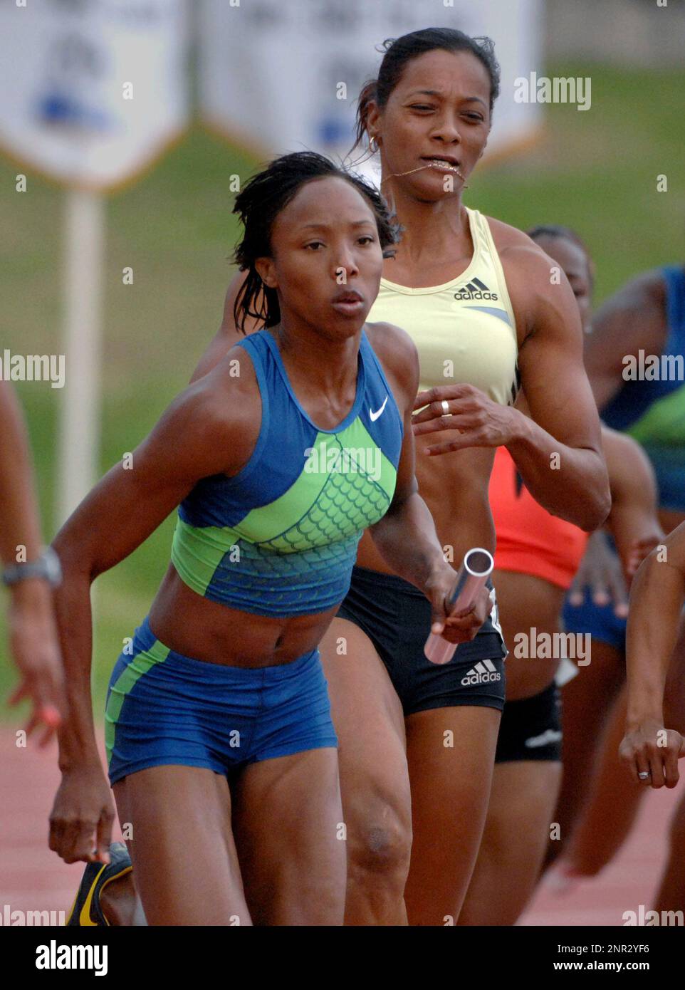 Sherone Simpson takes handoff from Geraldine Pillay on the second leg ...