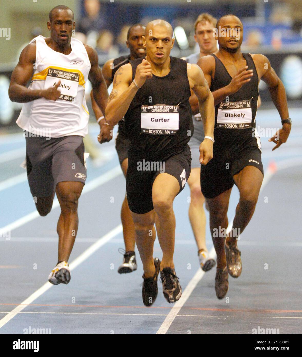 James Carter, center, leads Jamel Ashley, left, and Fernada Blakely in ...