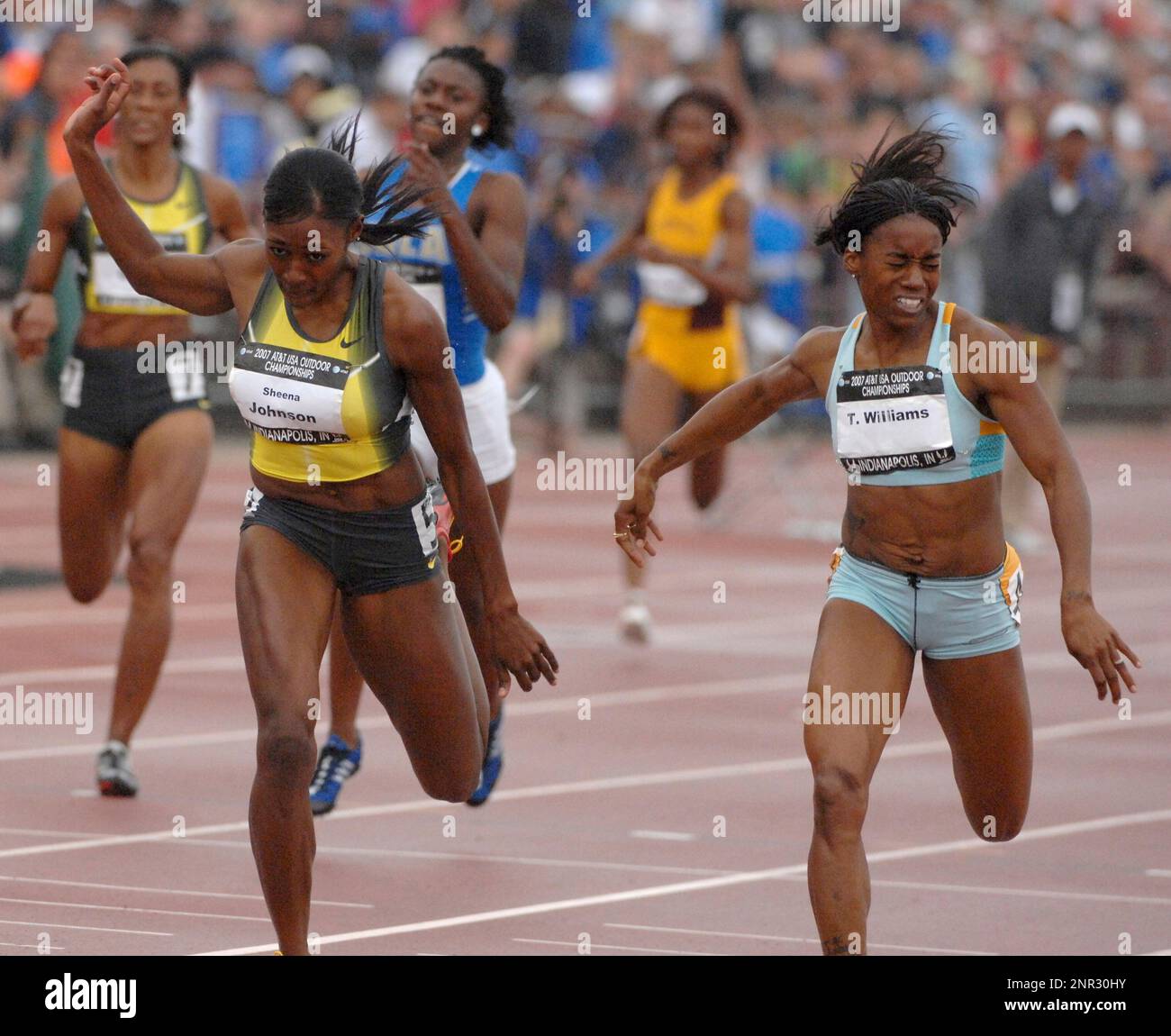 Tiffany Ross-Williams, right, edges Sheena Johnson at the finish to win ...