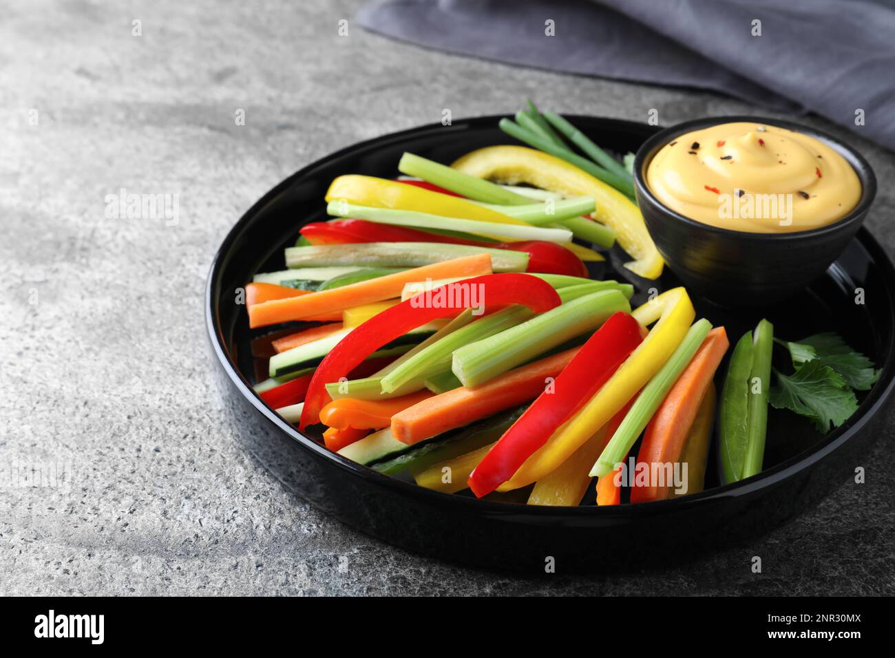 Fresh raw vegetable sticks and sauce on grey table Stock Photo - Alamy