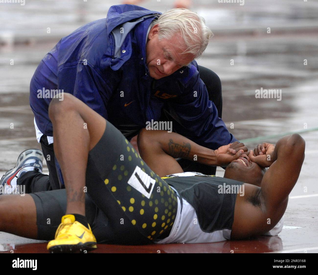 Xavier Carter aka X-Man lies on the track after a suffering a leg ...